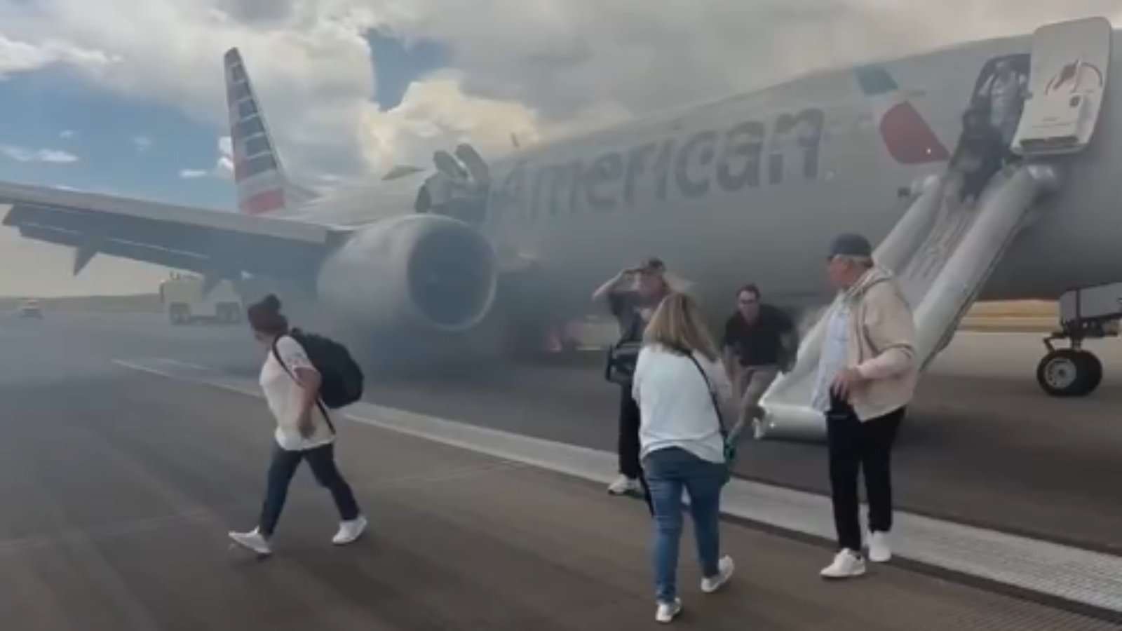 American Airlines Evacuated on Runway After Landing Gear Fire During ...